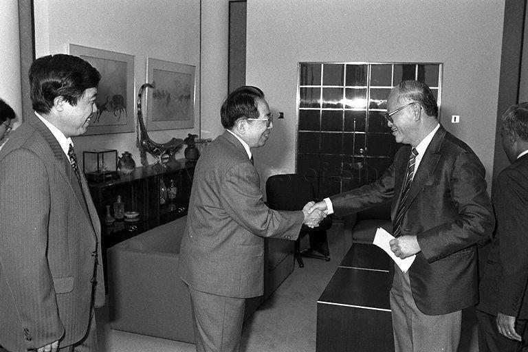 MINISTER HU PING OF PEOPLE'S REPUBLIC OF CHINA BEING GREETED