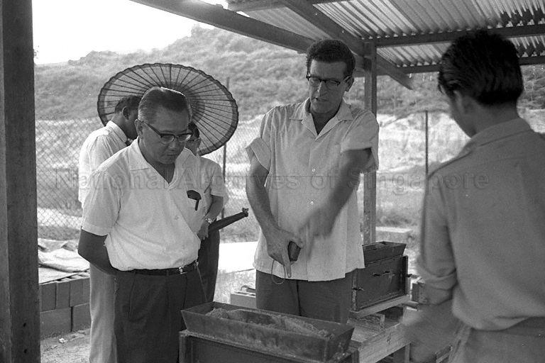 MINISTER FOR NATIONAL DEVELOPMENT LIM KIM SAN OBSERVING A