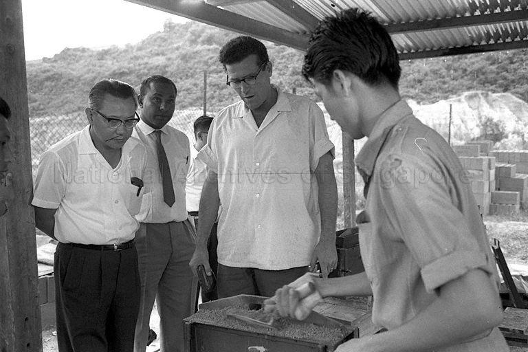 MINISTER FOR NATIONAL DEVELOPMENT LIM KIM SAN OBSERVING A