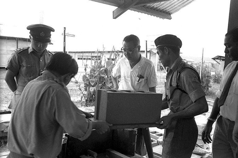 MINISTER FOR NATIONAL DEVELOPMENT LIM KIM SAN OBSERVING A
