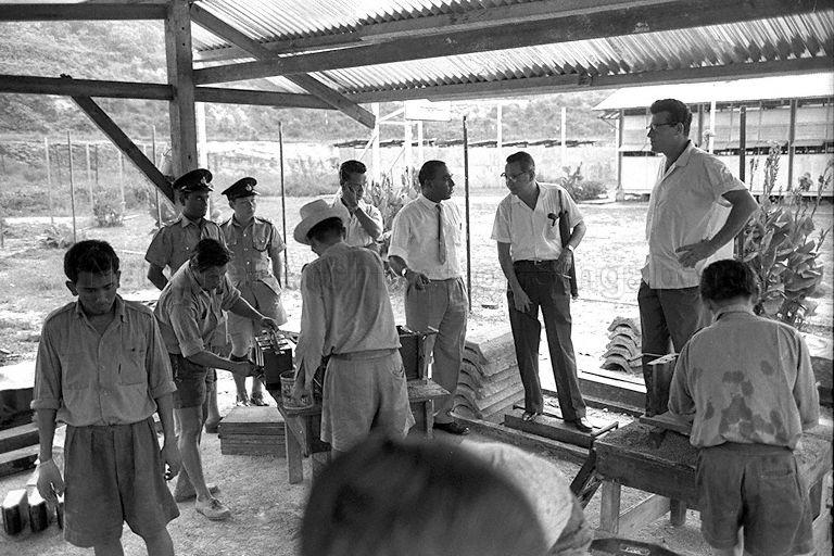 MINISTER FOR NATIONAL DEVELOPMENT LIM KIM SAN OBSERVING A