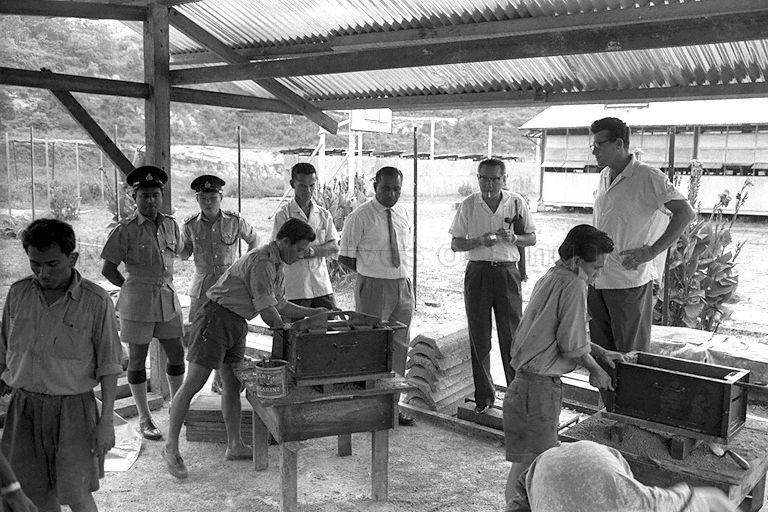 MINISTER FOR NATIONAL DEVELOPMENT LIM KIM SAN OBSERVING A