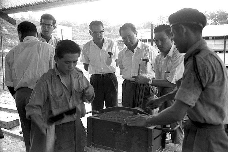 MINISTER FOR NATIONAL DEVELOPMENT LIM KIM SAN OBSERVING A