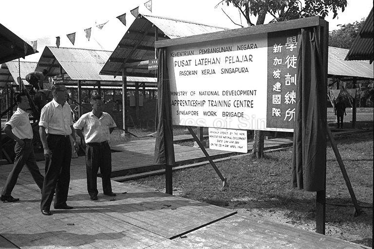 MINISTER FOR NATIONAL DEVELOPMENT LIM KIM SAN LOOKING AT