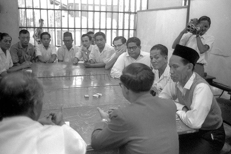 Deputy Prime Minister Dr Toh Chin Chye (right, back facing