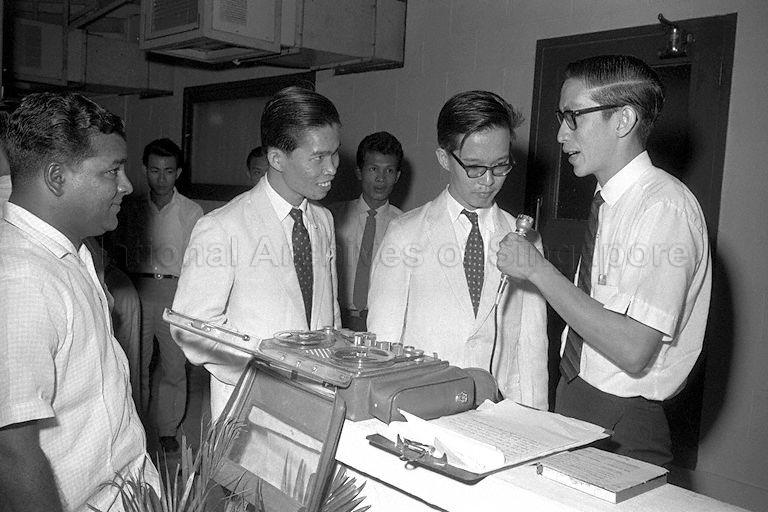 Tan Lian Ann (second from right) being interviewed at Paya