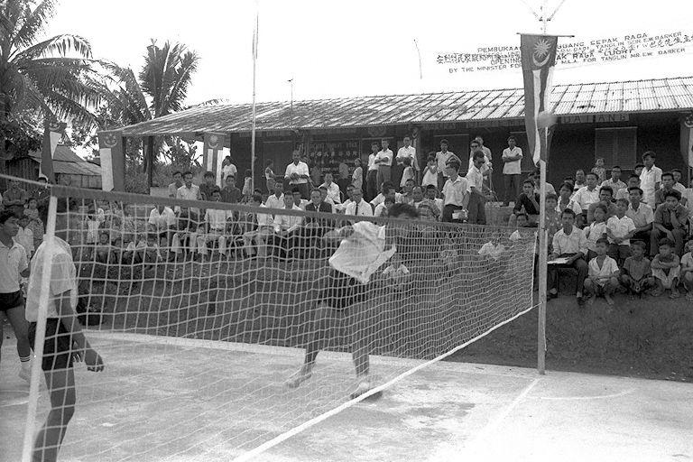 Game of sepak raga being played on court at Onraet Road