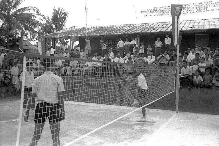 Game of sepak raga being played on court at Onraet Road