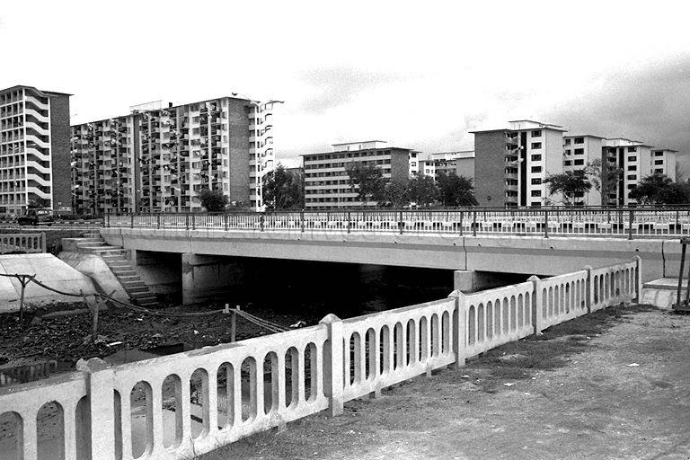 Bridge over Geylang River with flats at Jalan Satu and Jalan