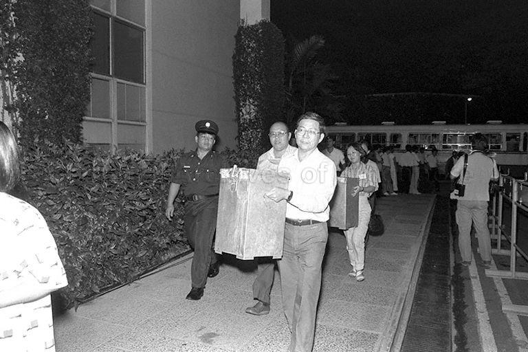 Sealed ballot boxes arriving at Singapore Conference Hall
