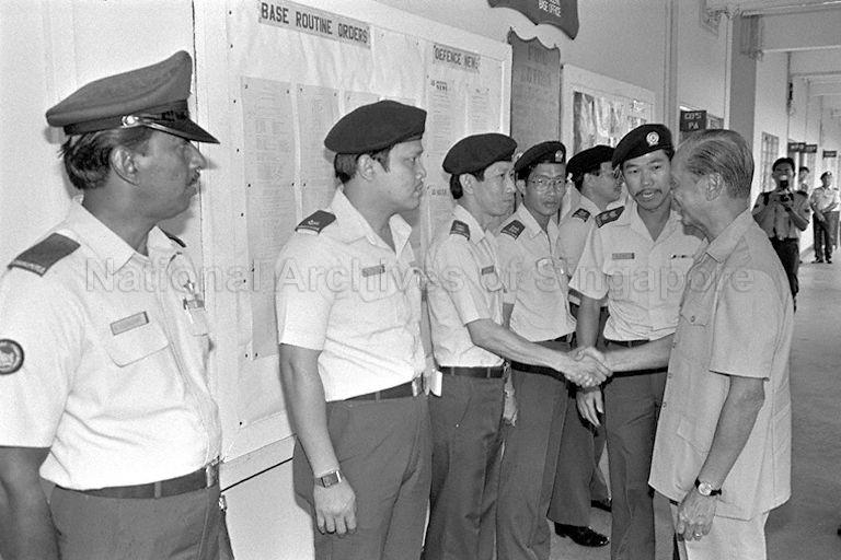 Officers greeting President Wee Kim Wee upon his arrival at