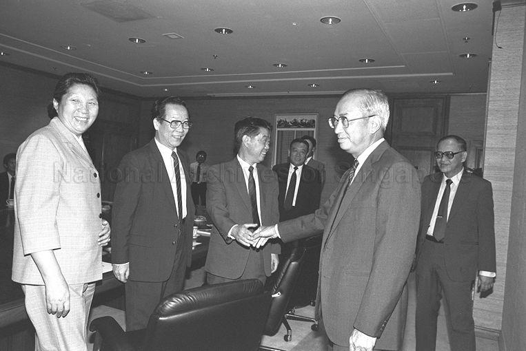 Minister for Finance Dr Richard Hu Tsu Tau exchanging