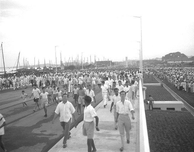 View of crowd on Merdeka Bridge during its opening by Chief