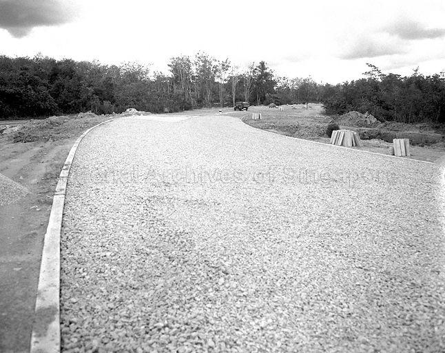 PHOTOGRAPH FROM PUBLIC WORKS DEPARTMENT SHOWING ROAD