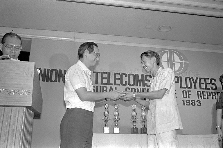 Minister without Portfolio Lim Chee Onn (left) presenting