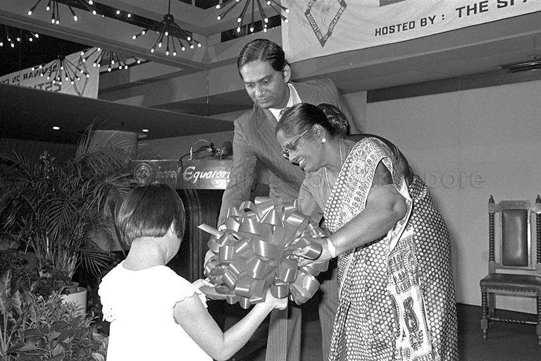 First Lady Mrs Devan Nair cutting ribbon to open seminar on