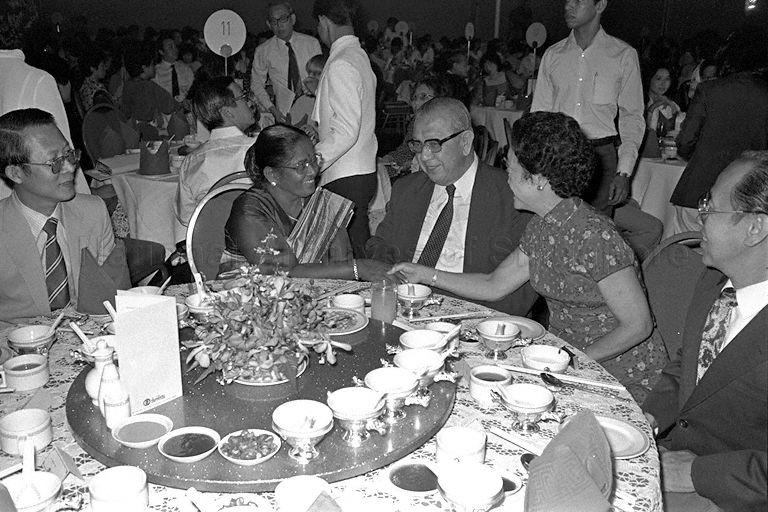 First Lady Mrs Devan Nair shaking hands with wife of
