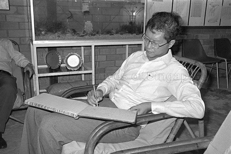 Minister of State for Education Dr Tay Eng Soon signing a