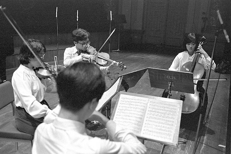 A string quartet in the western music section rehearsing at