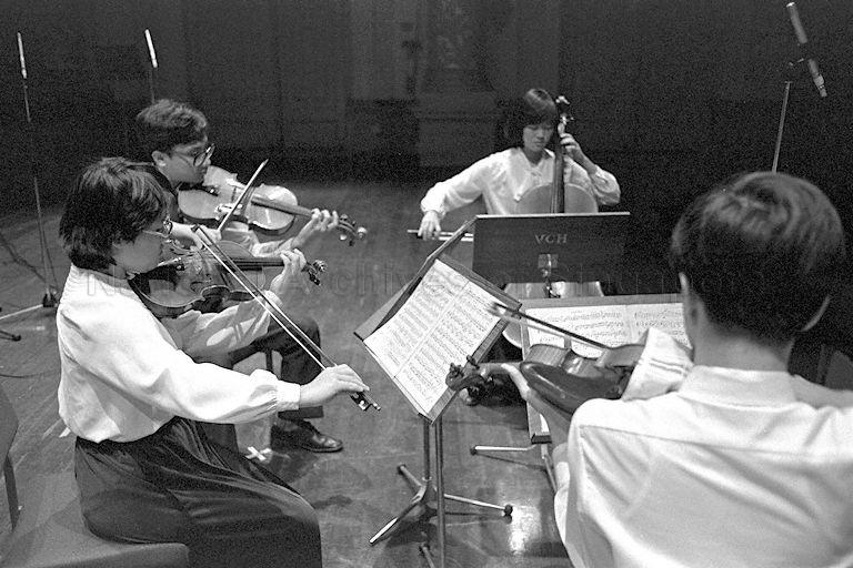 A string quartet in the western music section rehearsing at