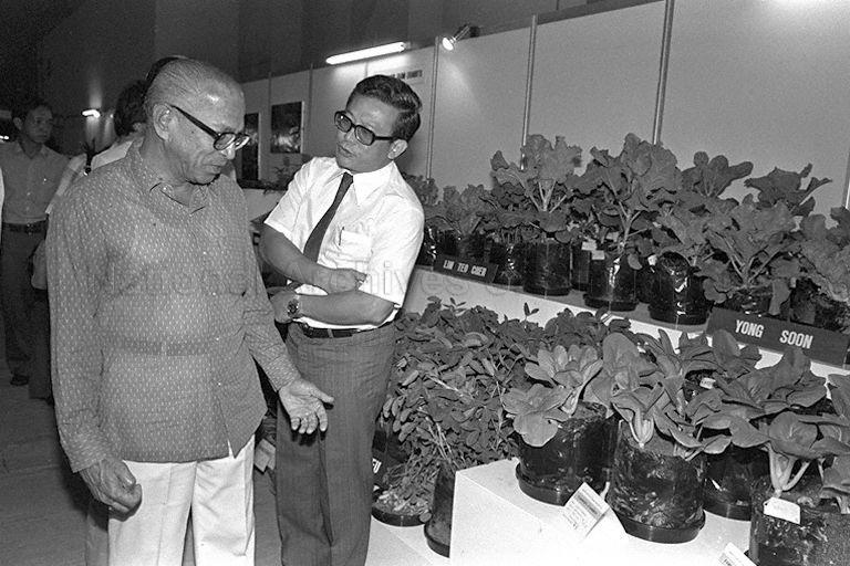President C V Devan Nair viewing an exhibit of homegrown