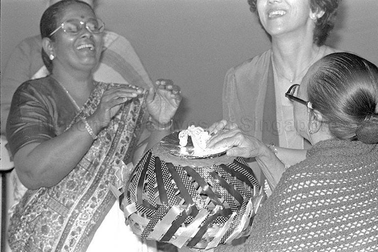 First Lady Mrs C V Devan Nair (left) releasing one of the
