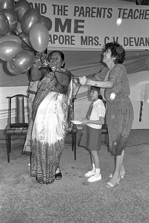 First Lady Mrs C V Devan Nair (left) releasing balloons