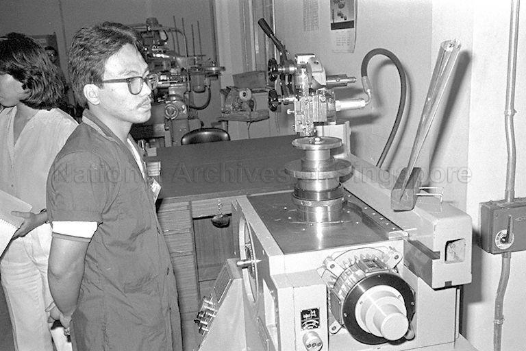 A trainee monitoring the function of lathe machine at TATA