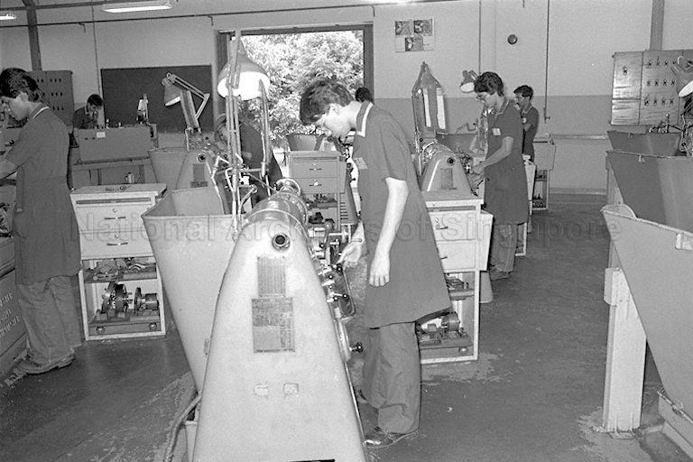 Trainees shaping tool parts with the help of lathe machines