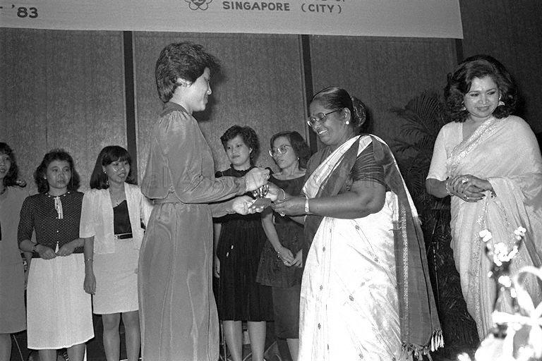 First Lady Mrs C V Devan Nair (second from right) presenting
