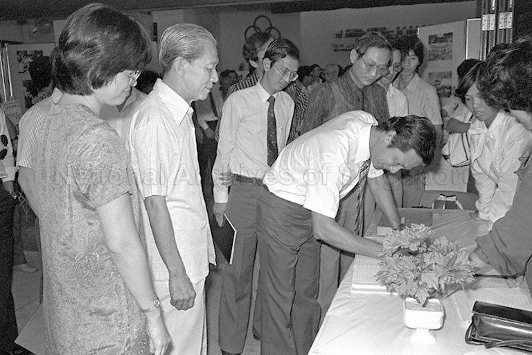 Acting Minister for Communications Dr Yeo Ning Hong signing