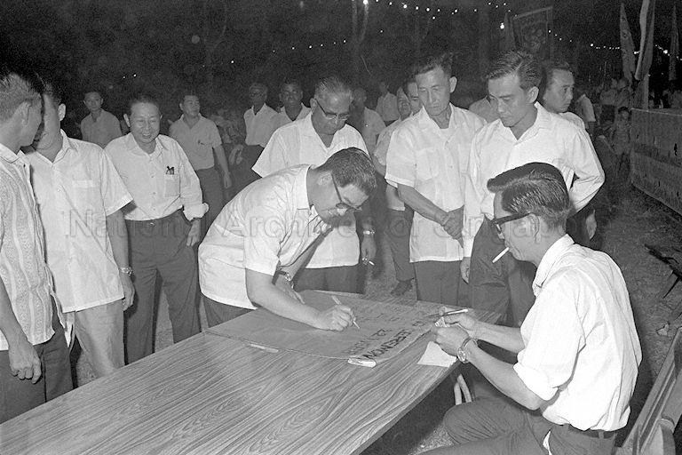 Member of Parliament for Sembawang Teong Eng Siong signing a