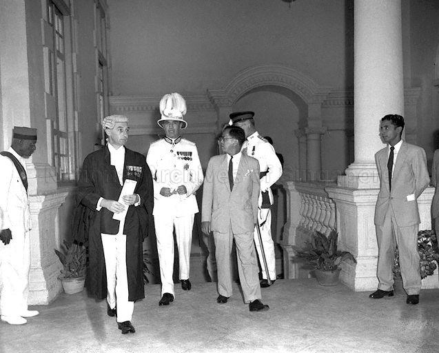 Sir William Goode (third from left) arriving at Victoria