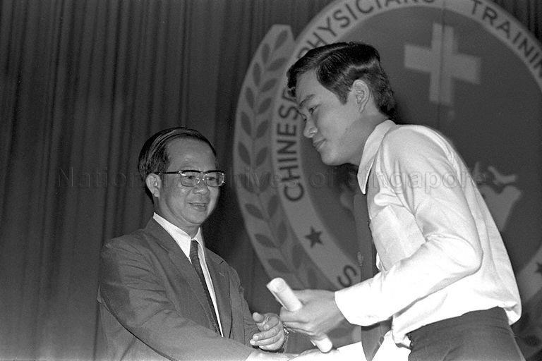 Minister for Health Dr Toh Chin Chye presenting scrolls at