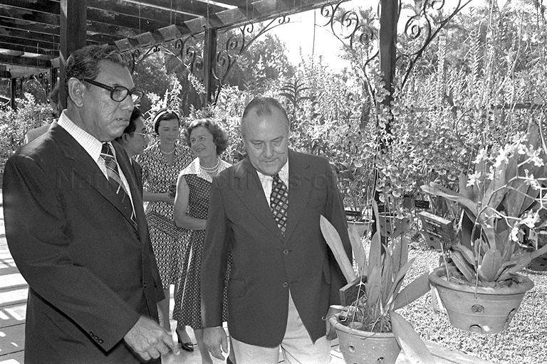 Prime Minister of New Zealand Robert Muldoon being shown