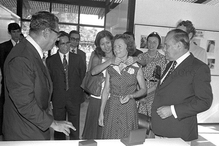 Mrs Thea Dale Muldoon being presented with a gold-plated