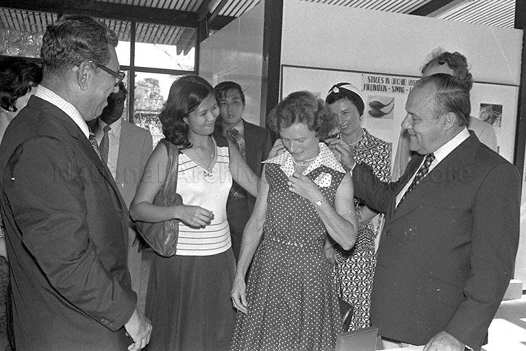 Mrs Thea Dale Muldoon being presented with a gold-plated