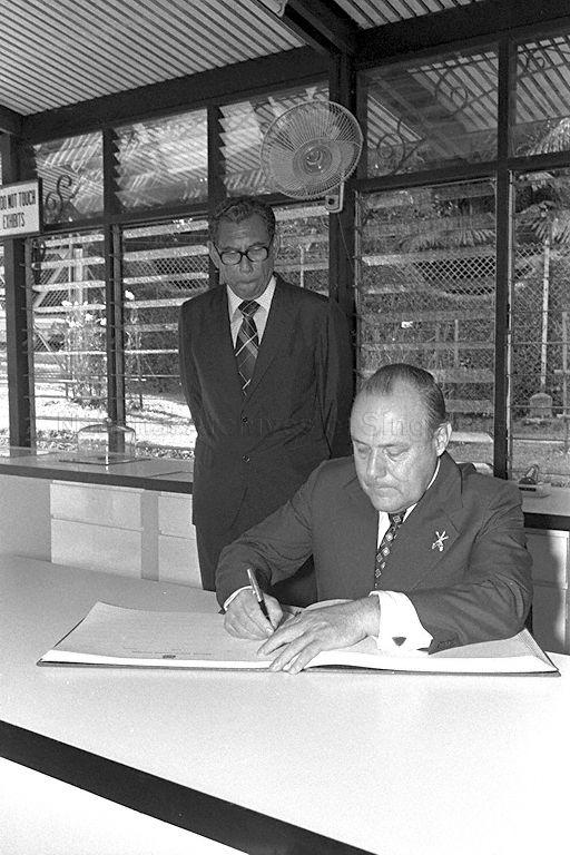 Prime Minister of New Zealand Robert Muldoon signing guest