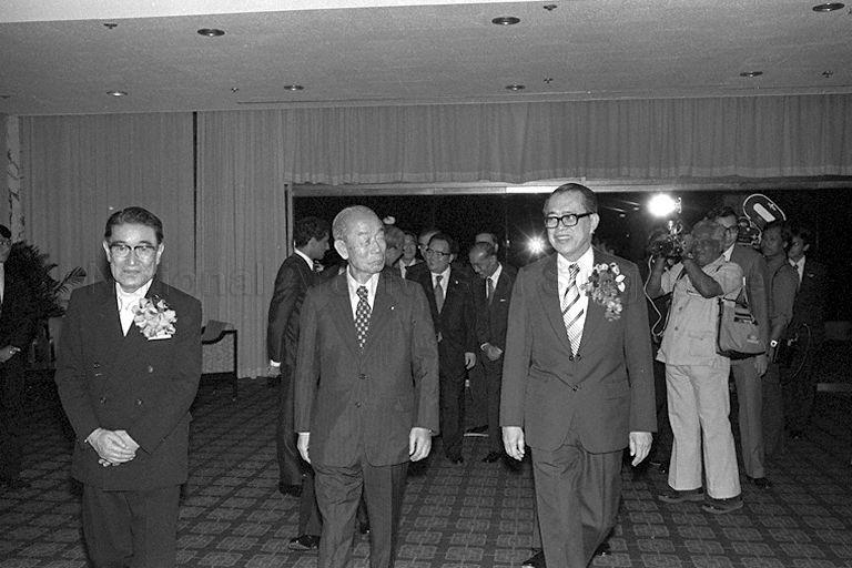 Japanese Prime Minister Takeo Fukuda, escorted by Minister