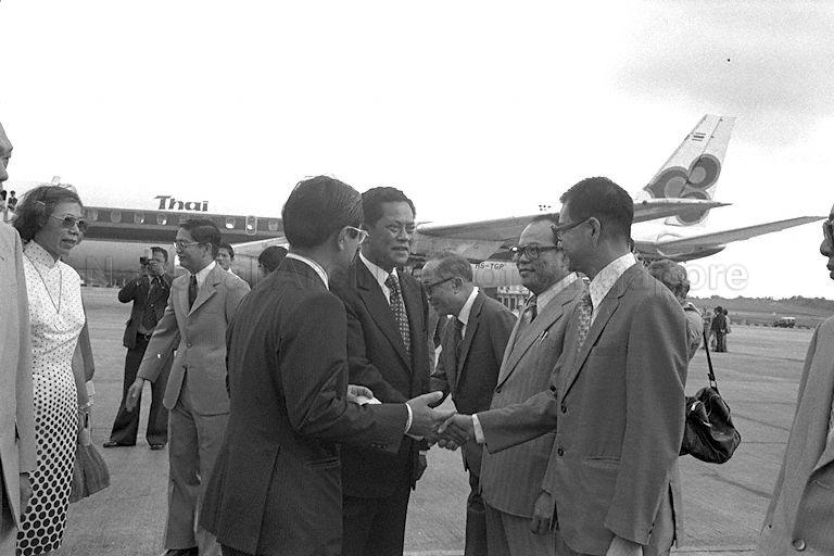 Prime Minister Lee Kuan Yew (partially hidden on left) and