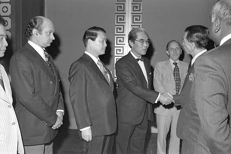 President Dr Benjamin Sheares being greeted at the banquet