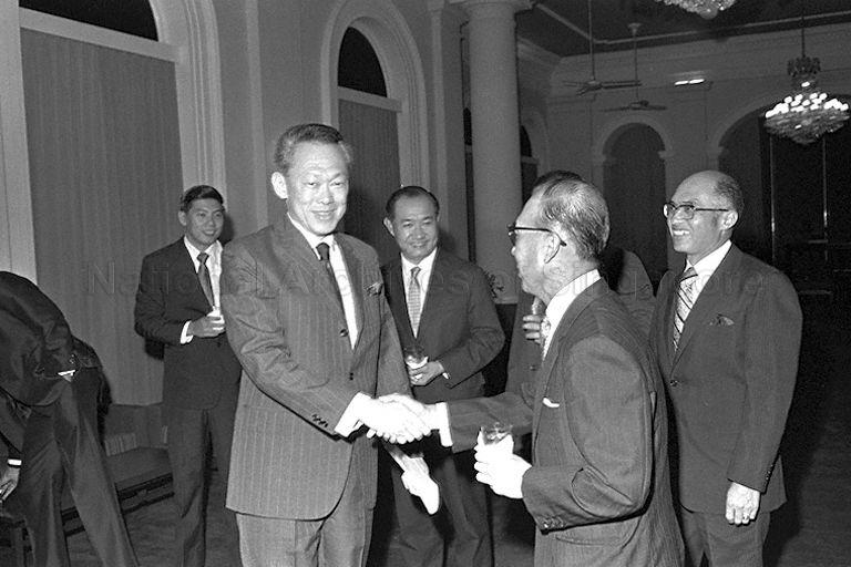 Prime Minister Lee Kuan Yew greeting guests during a private