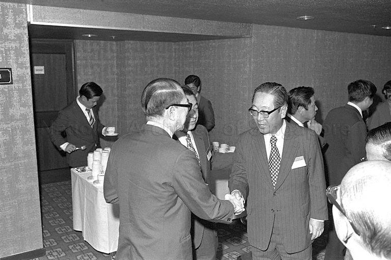 Minister for Finance Hon Sui Sen (foreground, back to camera
