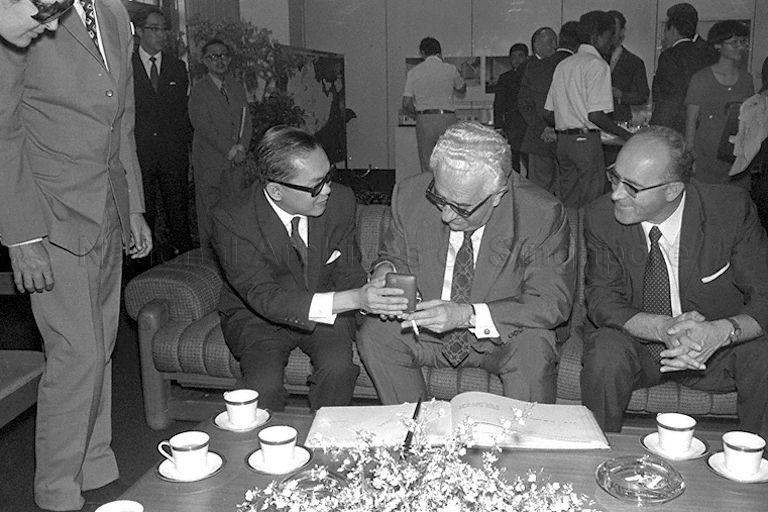 (Seated) Chairman of Housing and Development Board (HDB) Lee