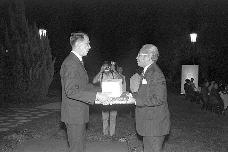 President Dr Benjamin Henry Sheares presenting souvenirs to