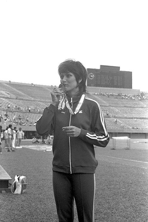 Heather Merican kissing her gold medal - the first won by