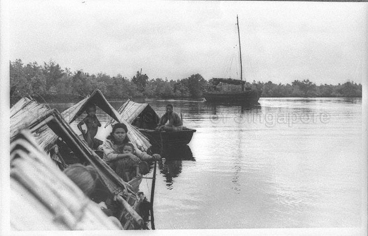 Orang Laut (Sea People) families on board their houseboats