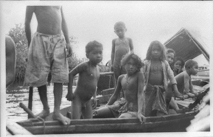 Orang Laut (Sea People) family on board their houseboat
