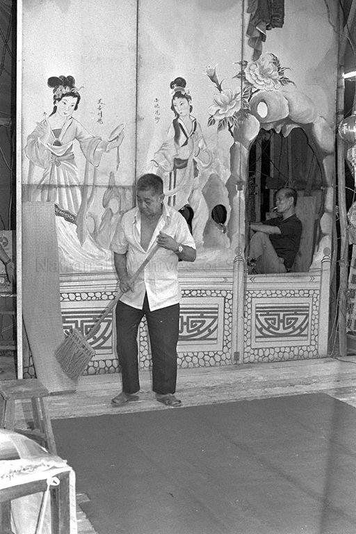 Teochew opera -- View of stagehand sweeping the stage and a