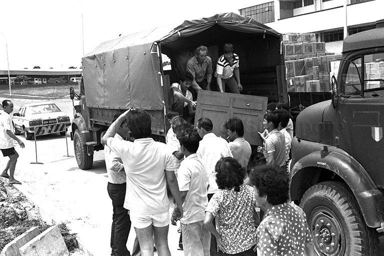 Pulau Tekong -- View of devotees unloading items from army